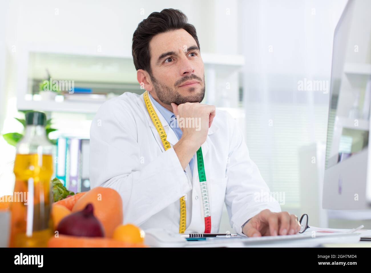 portrait of male nutritionist in his office Stock Photo - Alamy