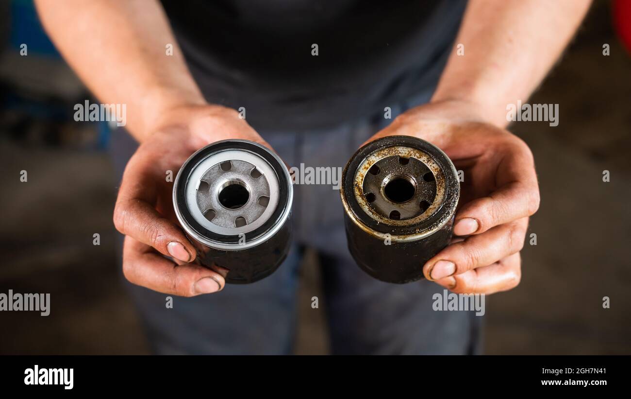 Mechanic holds spare part hi-res stock photography and images - Alamy