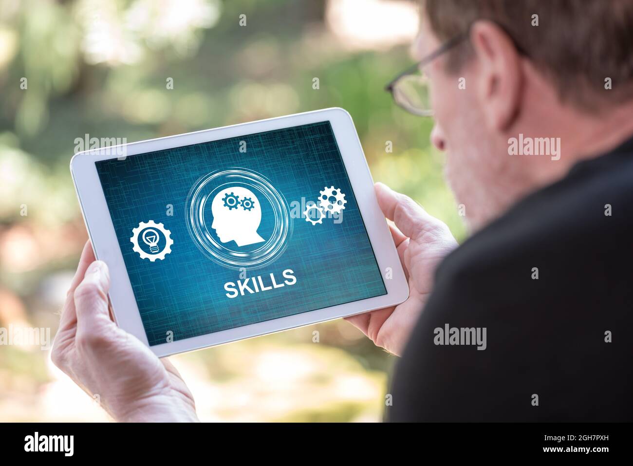 Tablet screen displaying a skills concept Stock Photo - Alamy