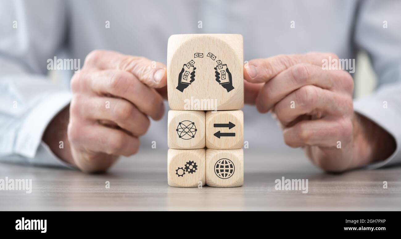 Wooden blocks with symbol of money transfer concept Stock Photo - Alamy