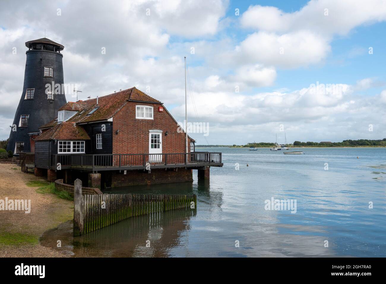 old historic mill at Langstone Harbour Hampshire England reflecting in ...