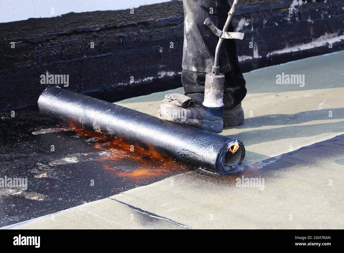 Professional flat roof waterproofing with bitumen welded sheeting Stock ...