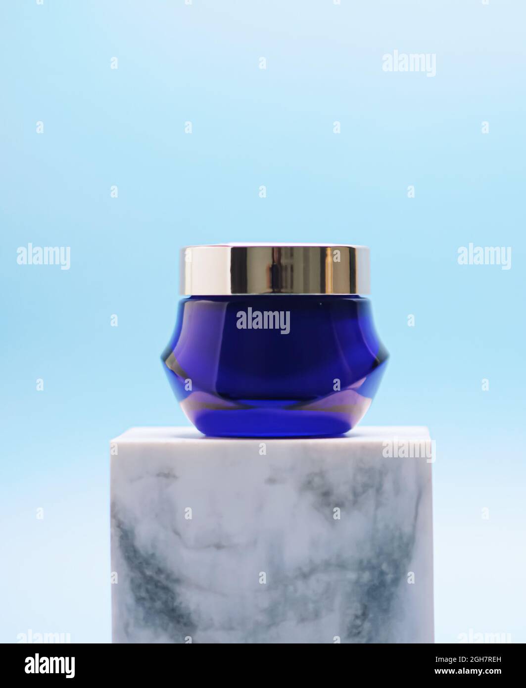 Facial cream jar on blue background, luxury skincare products, beauty ...