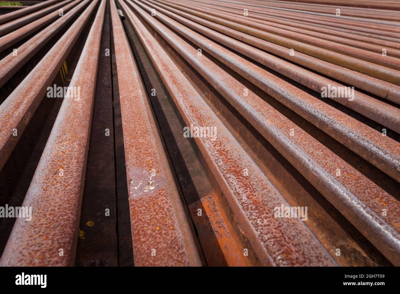 railroad tracks with rust on rock background Stock Photo - Alamy