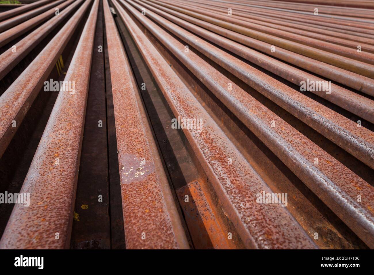 railroad tracks with rust on rock background Stock Photo - Alamy