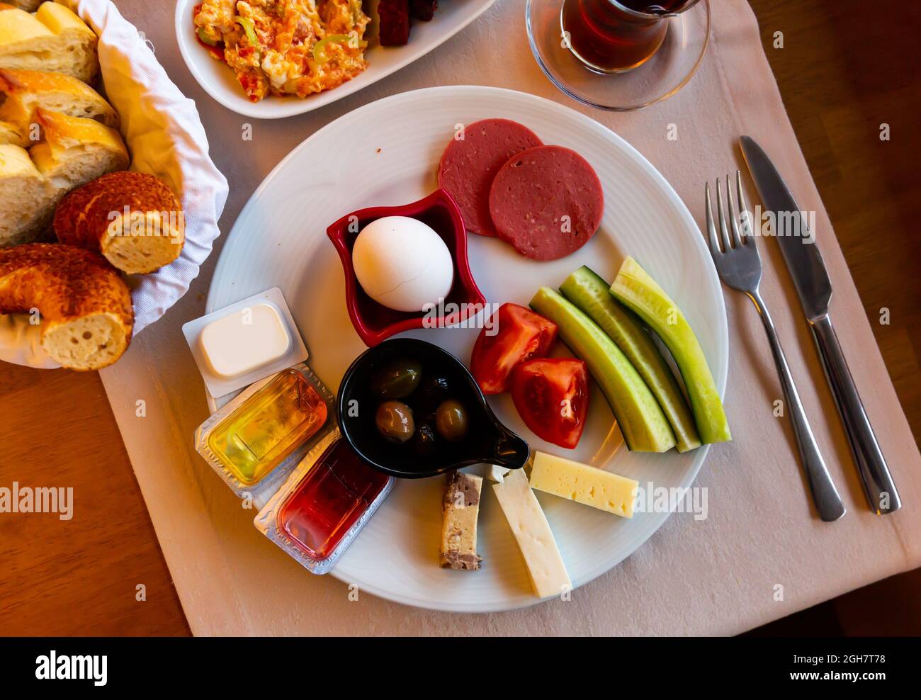 Turkish breakfast: egg, vegetables, cheeses, olives and ham. Halal ...