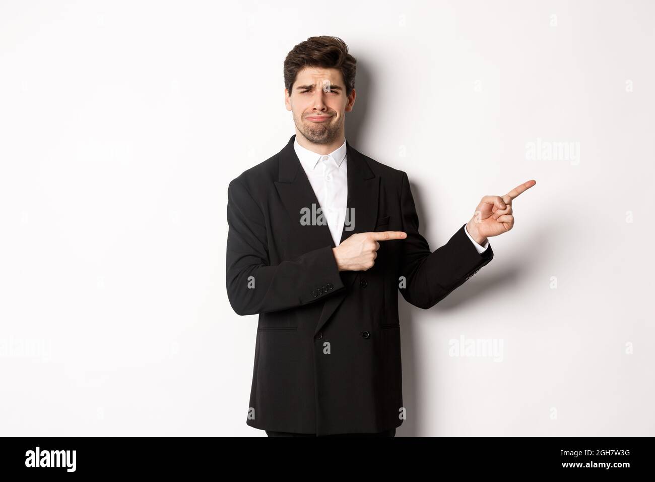 Image of devestated man in party suit, crying and complaining, pointing ...