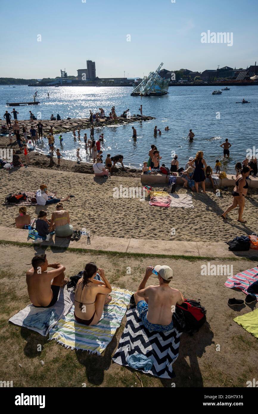 People enjoying the beach on a hot summer day in Oslo, Norway, Europe ...