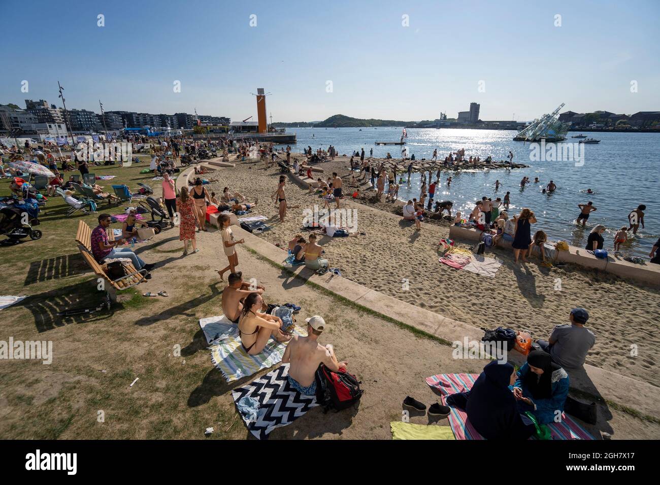 People enjoying the beach on a hot summer day in Oslo, Norway, Europe ...