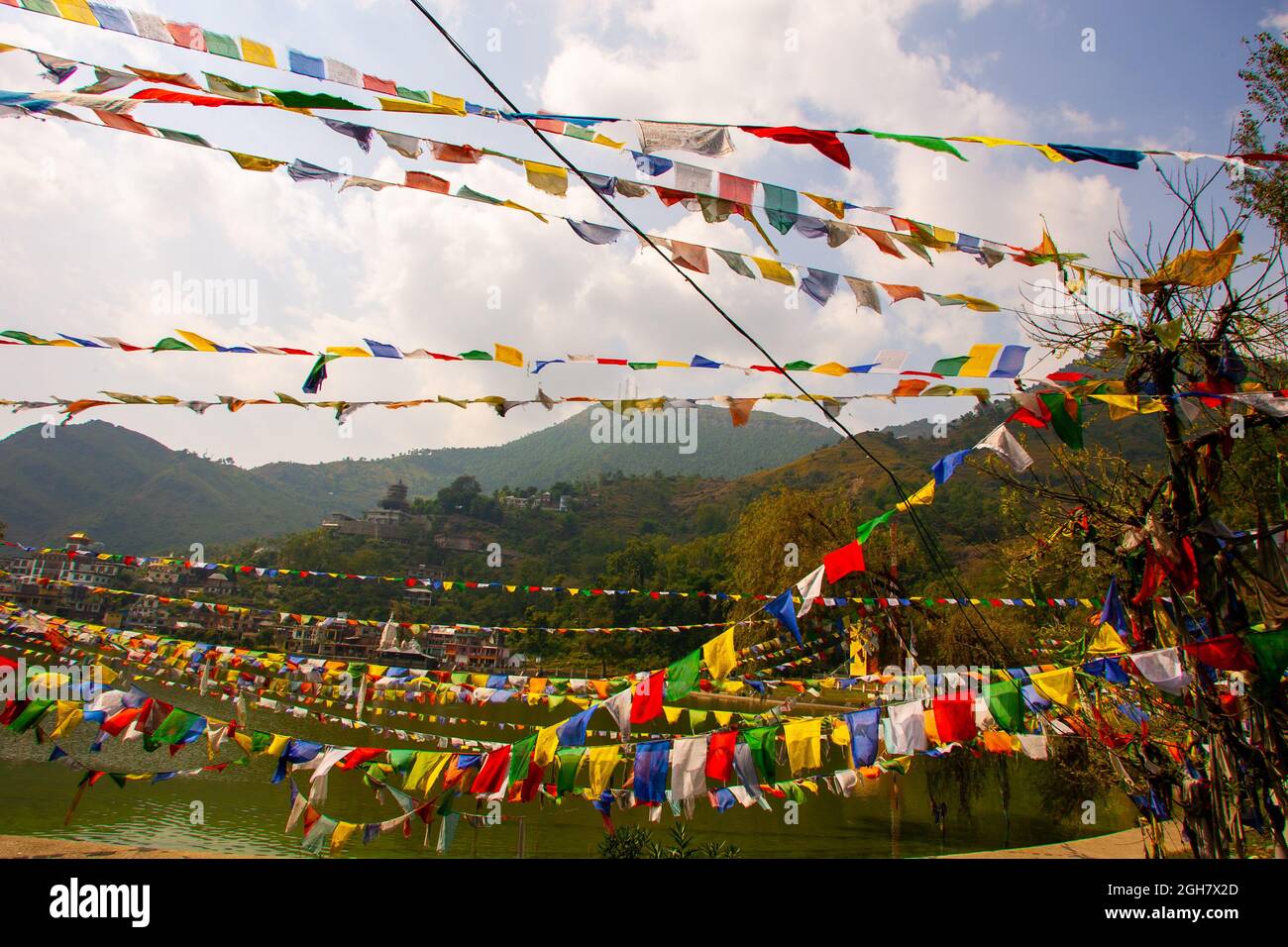Buddhist prayer flags waving on the banks of the Beas River at Manali ...
