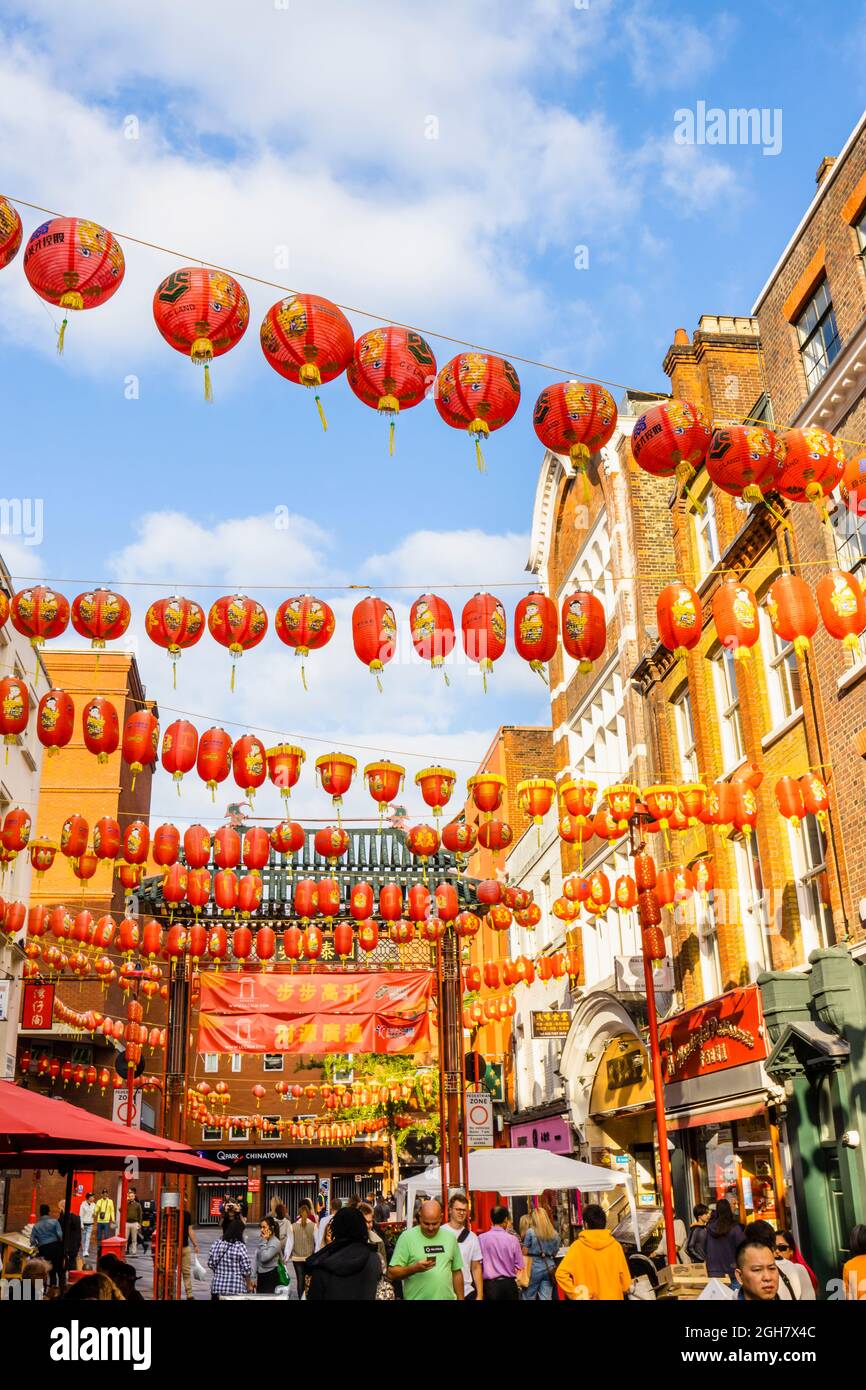 Colourful red and gold Chinese lanterns strung across Gerrard Street in Chinatown in the West ...