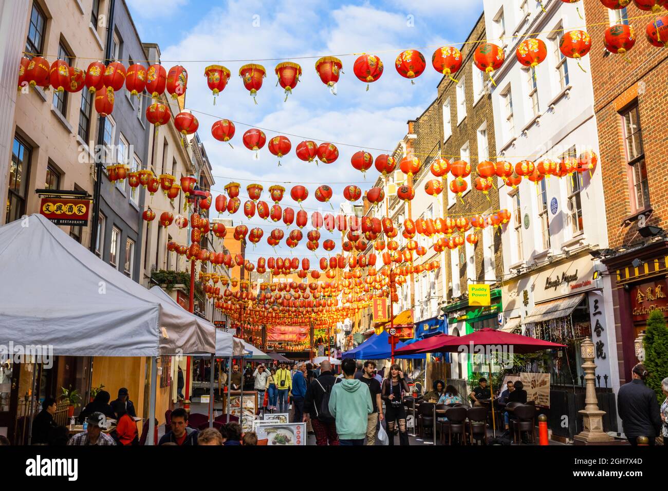 Colourful red and gold Chinese lanterns strung across Gerrard Street in Chinatown in the West ...