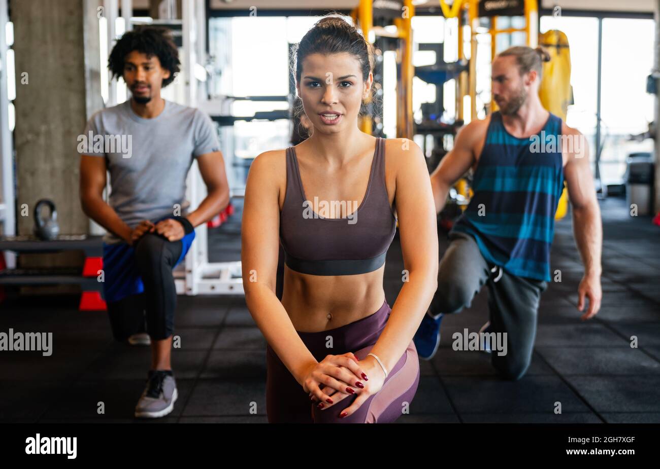 Beautiful fit people working out in gym together Stock Photo - Alamy