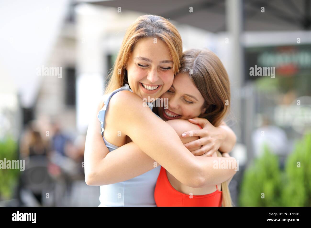 Two girls cuddling hi-res stock photography and images - Alamy