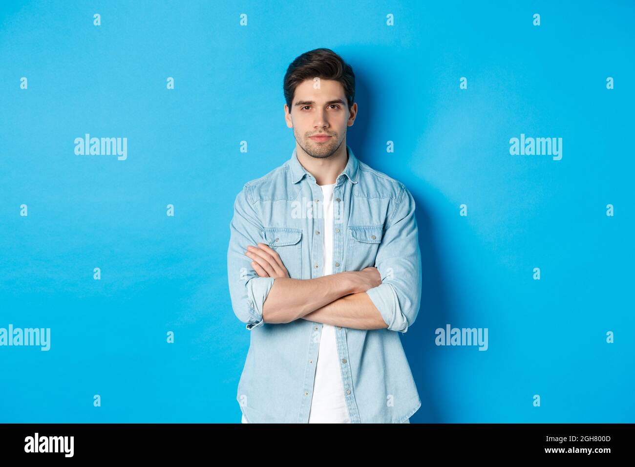 Image of handsome caucasian man in casual outfit, looking serious and ...