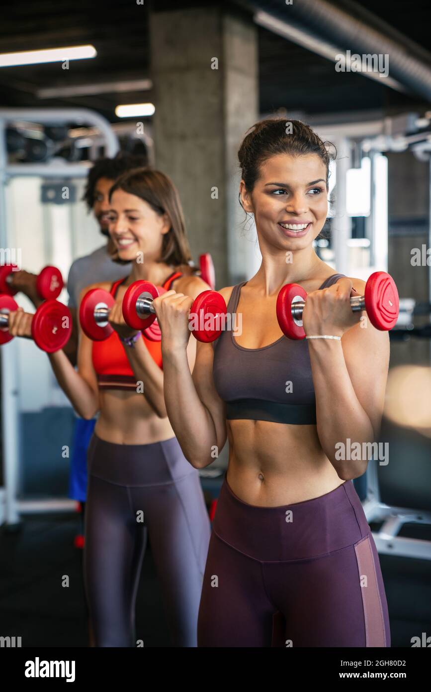 Group of fit people at the gym exercising Stock Photo - Alamy