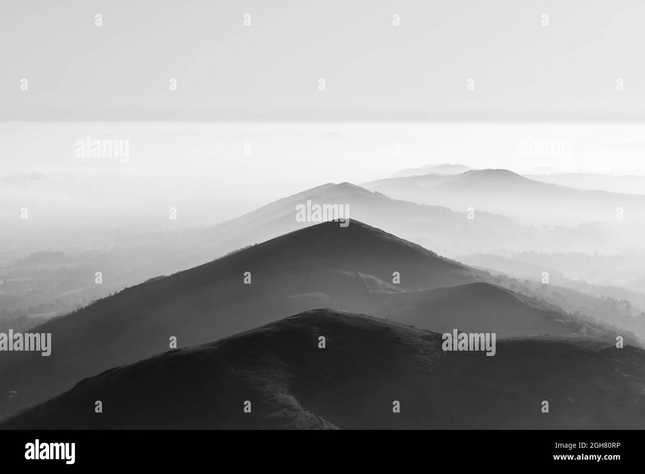 Grayscale shot of the misty Black Mountains in Wales Stock Photo - Alamy