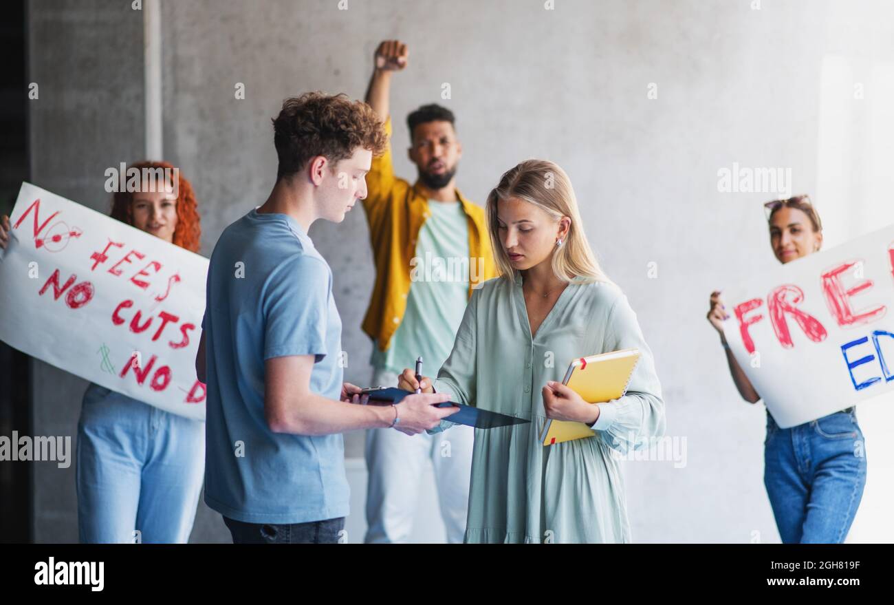 University students activists protesting indoors, fighting for free ...