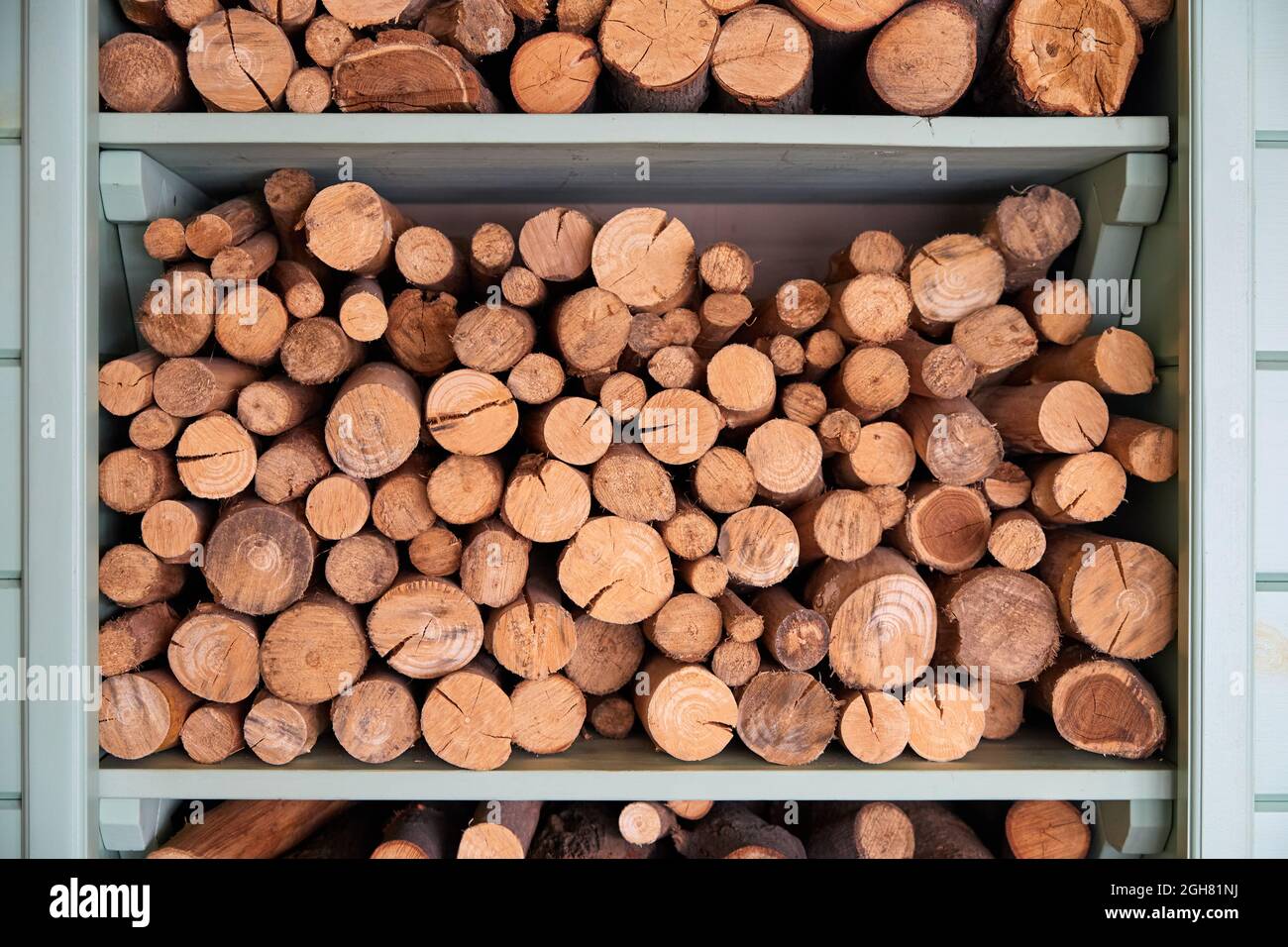 Background of firewoods in a woodshed Stock Photo - Alamy