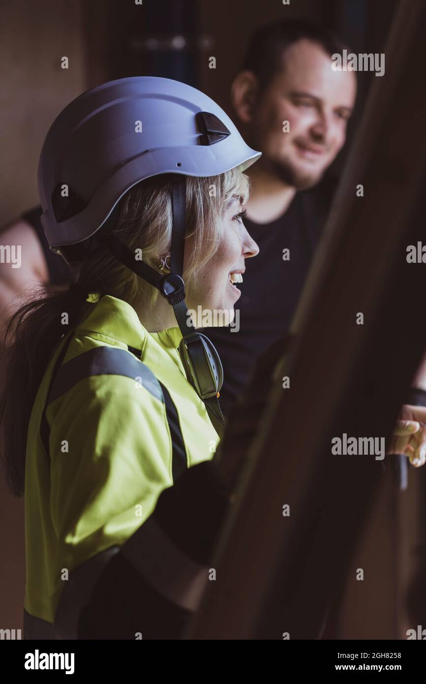 Smiling professional female construction hi-res stock photography and ...