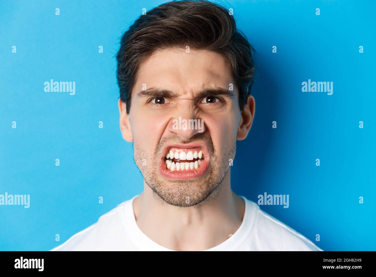 Headshot of angry caucasian man looking with scorn and dismay, being ...