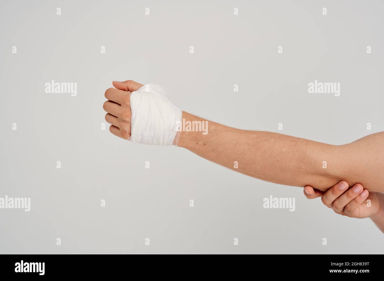 male patient bandaged hand injury to fingers hospitalization light ...