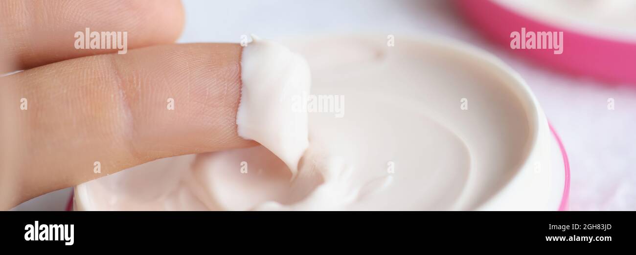 Cream on fingers hi-res stock photography and images - Alamy