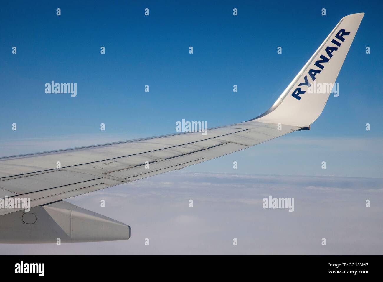Passenger view of the wing of a Ryanair Boeing 737-800wing as the plane ...