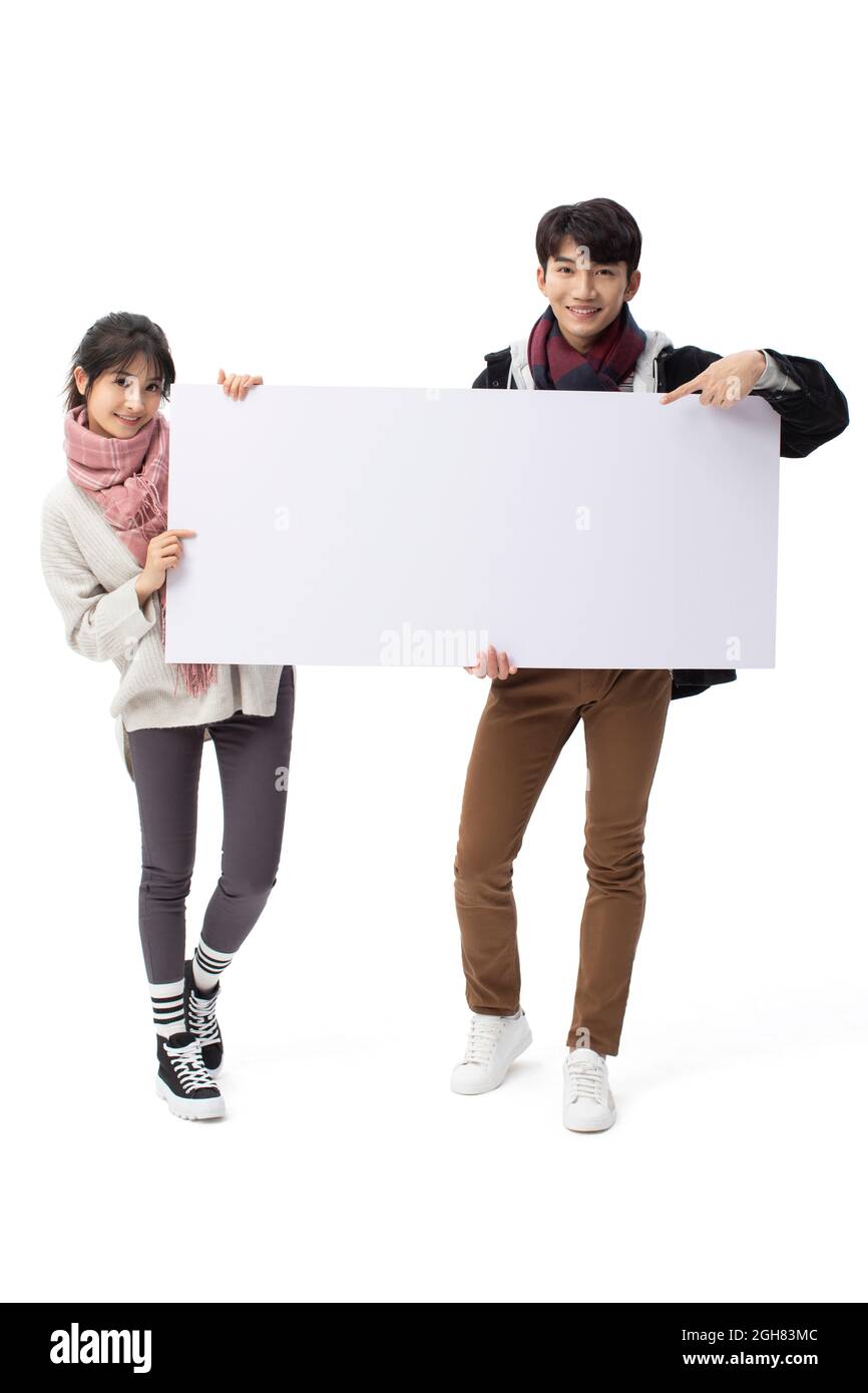 Two people looking at bulletin board hi-res stock photography and ...