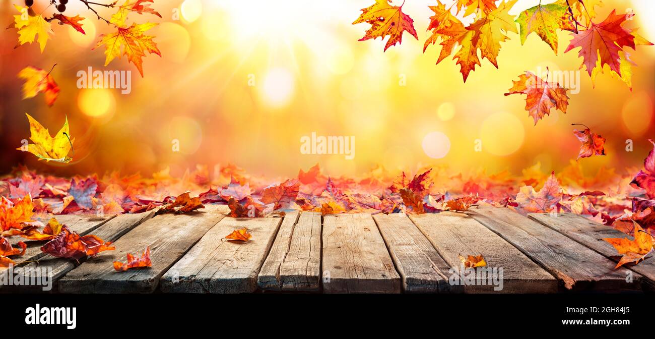Fall Table - Autumn Leaves Falling On Wooden Plank Stock Photo - Alamy