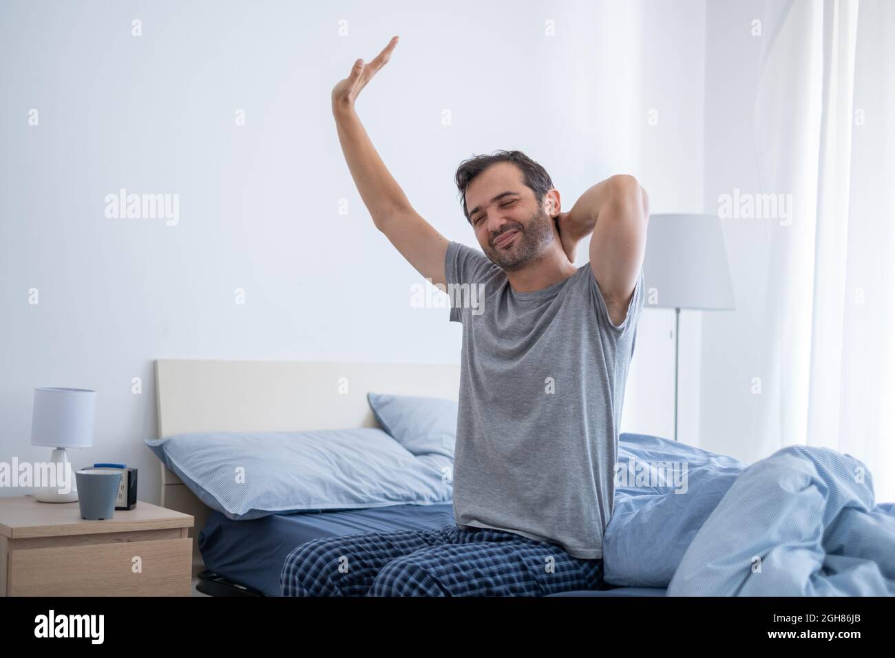 Male stretching bed hi-res stock photography and images - Alamy