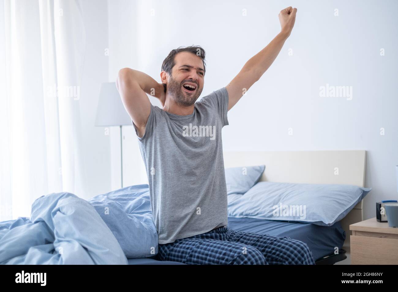 Man waking up bed hi-res stock photography and images - Alamy