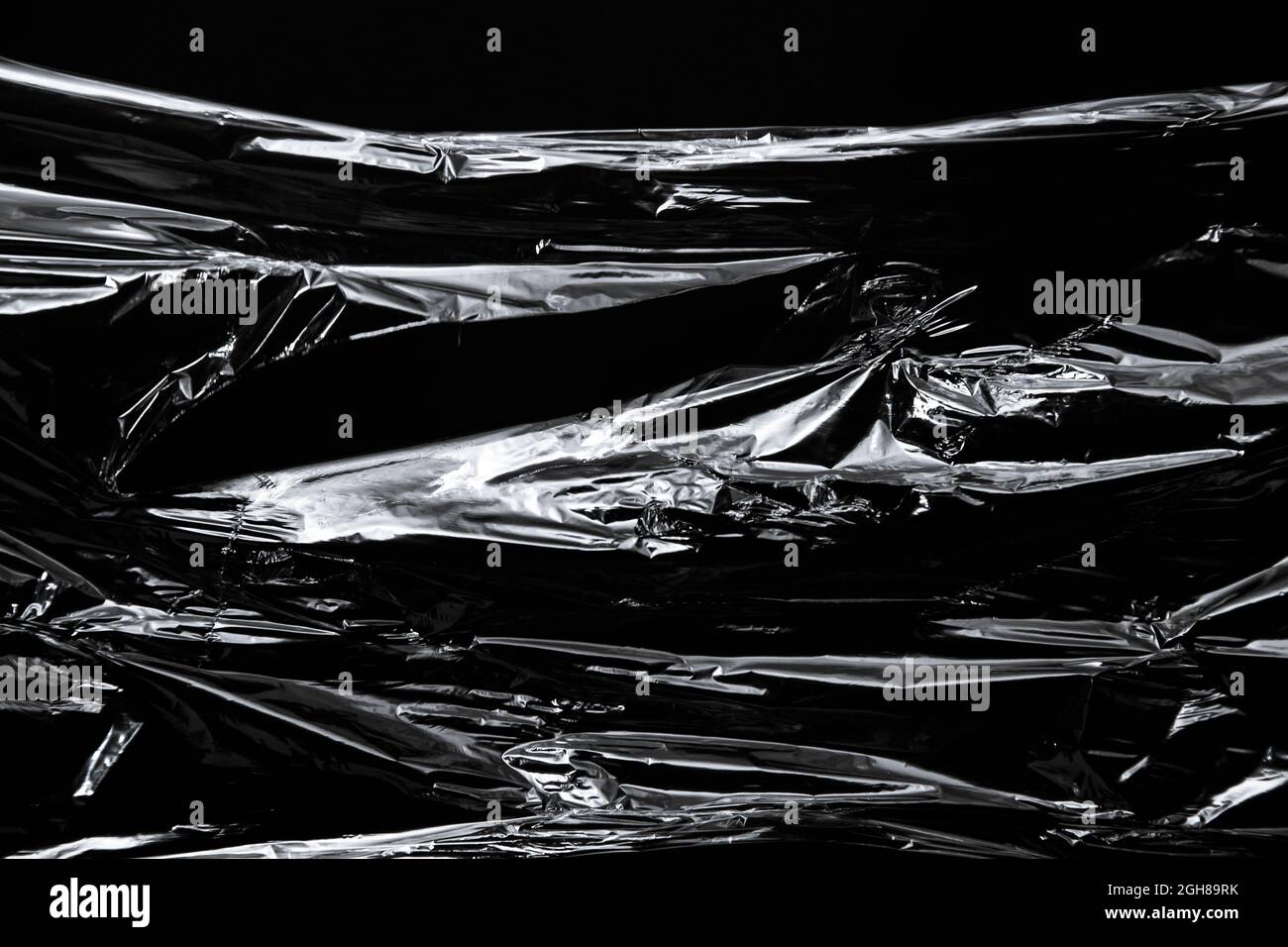 Picture of the polyethylene wrap on black background Stock Photo - Alamy