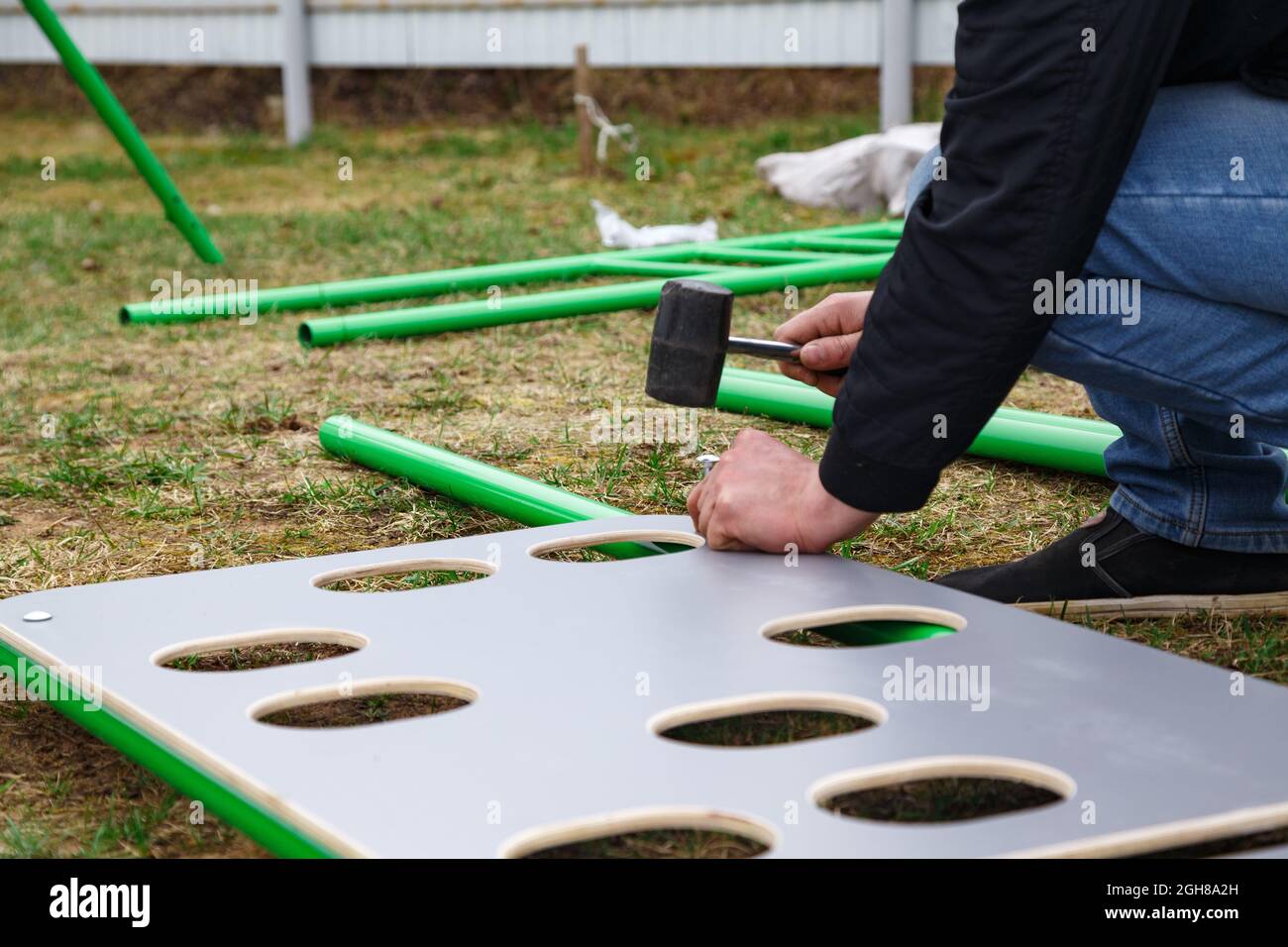 Photo of the installation of metal playground on the ground Stock Photo ...