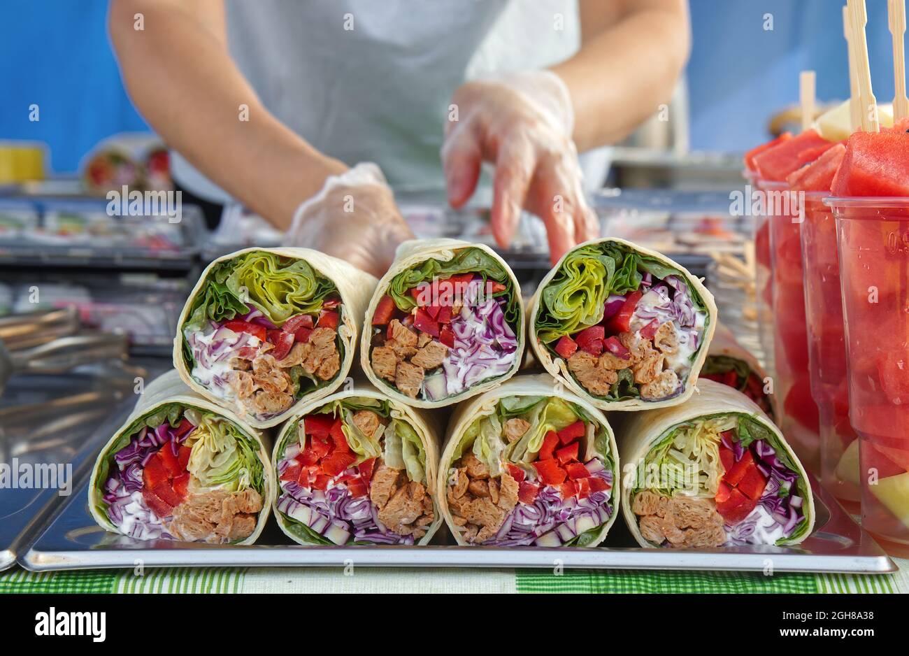 Wraps stuffed with meat and vegetables prepares for sale to the ...