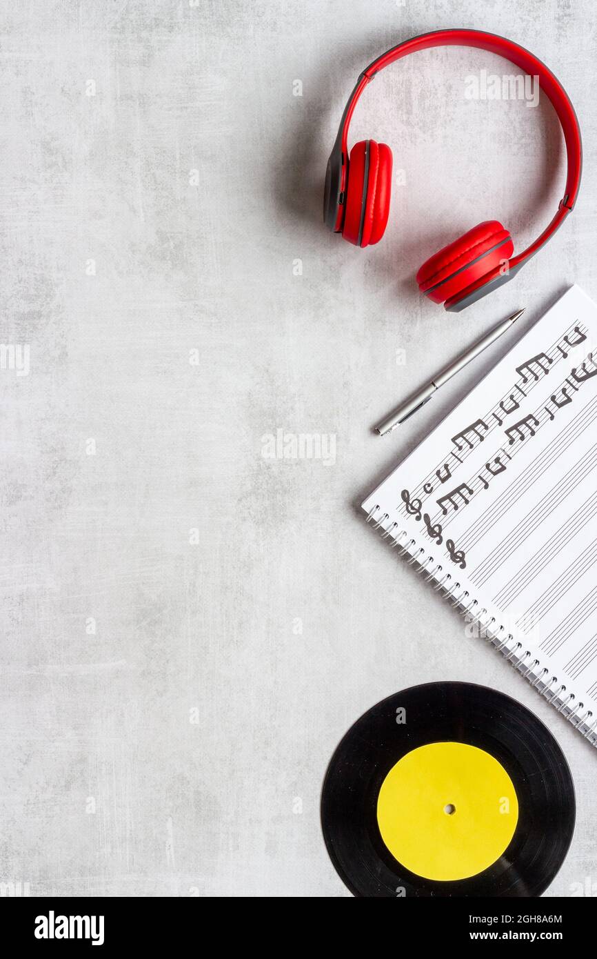Music sheets with musical notes and headphones, top view Stock Photo ...