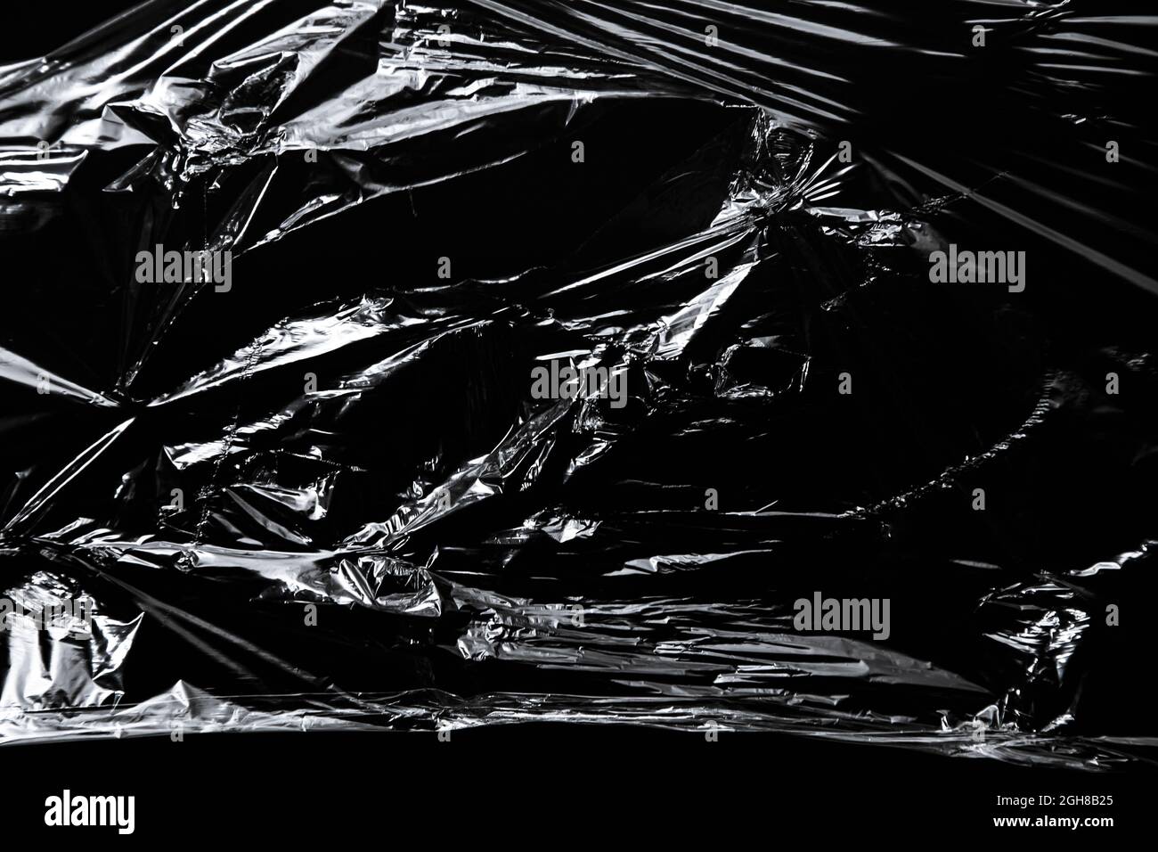 Photo of the polyethylene surface on black background Stock Photo - Alamy