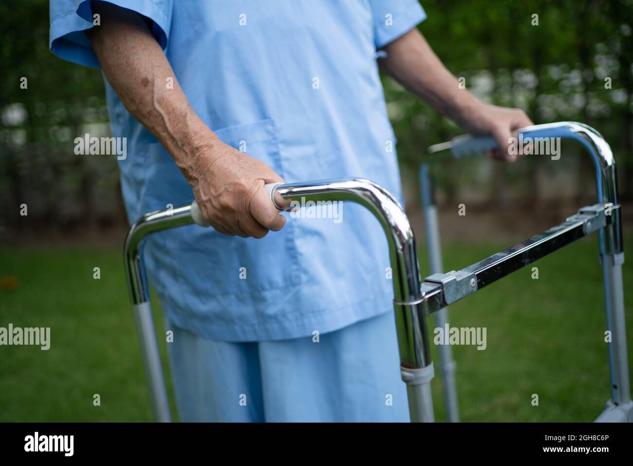 Asian senior or elderly old lady woman use walker with strong health ...