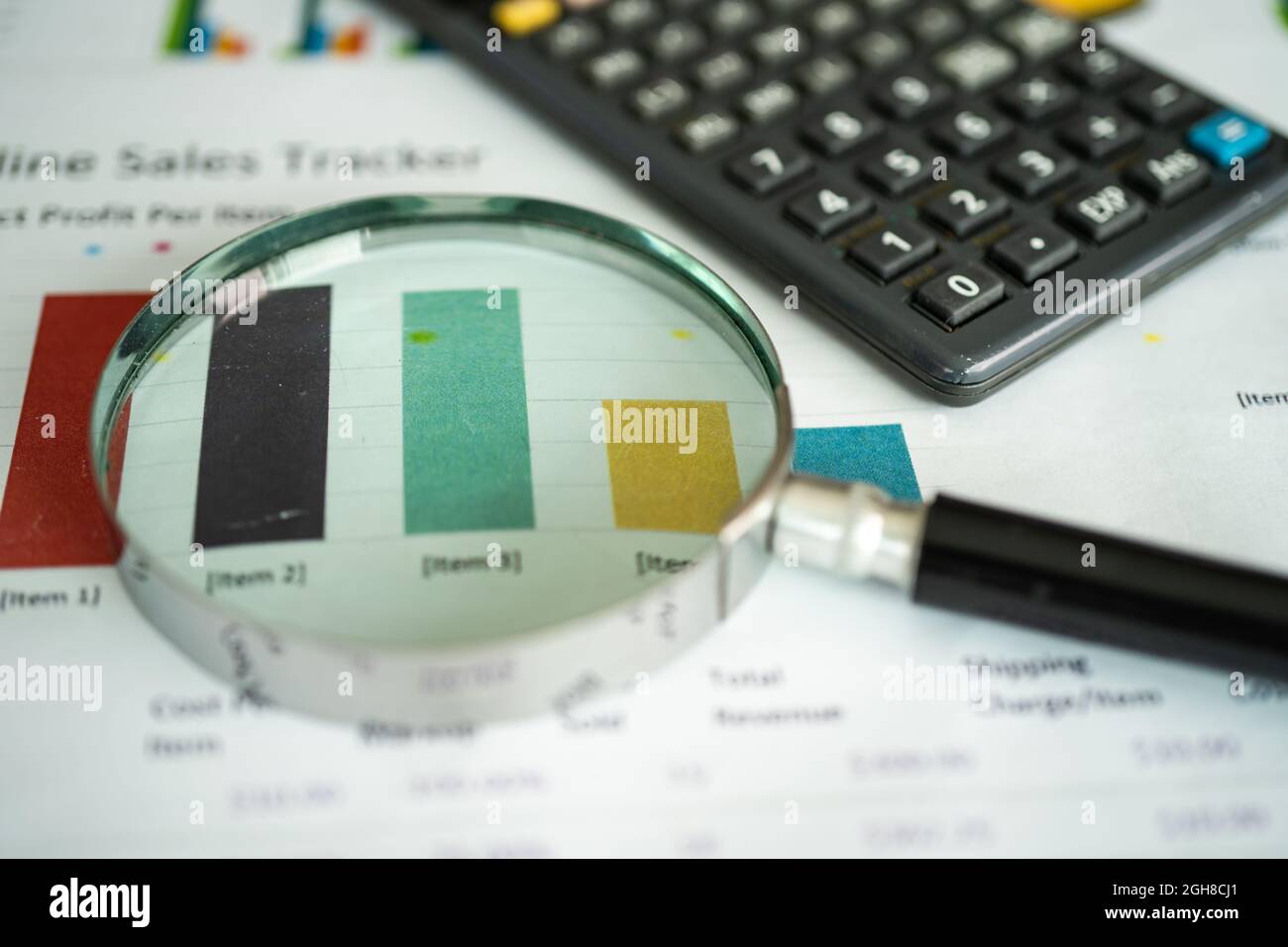 Magnifying glass on charts graphs paper. Financial development, Banking ...