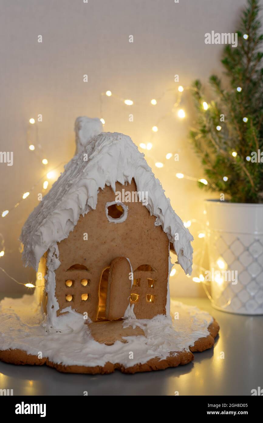 Gingerbread house on blurred lights background Stock Photo - Alamy