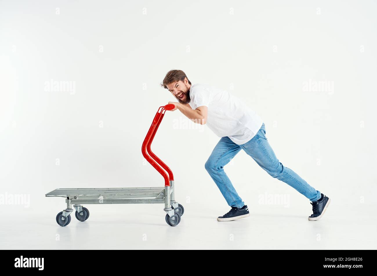 Cheerful man ride a cart entertainment shipping isolated background ...