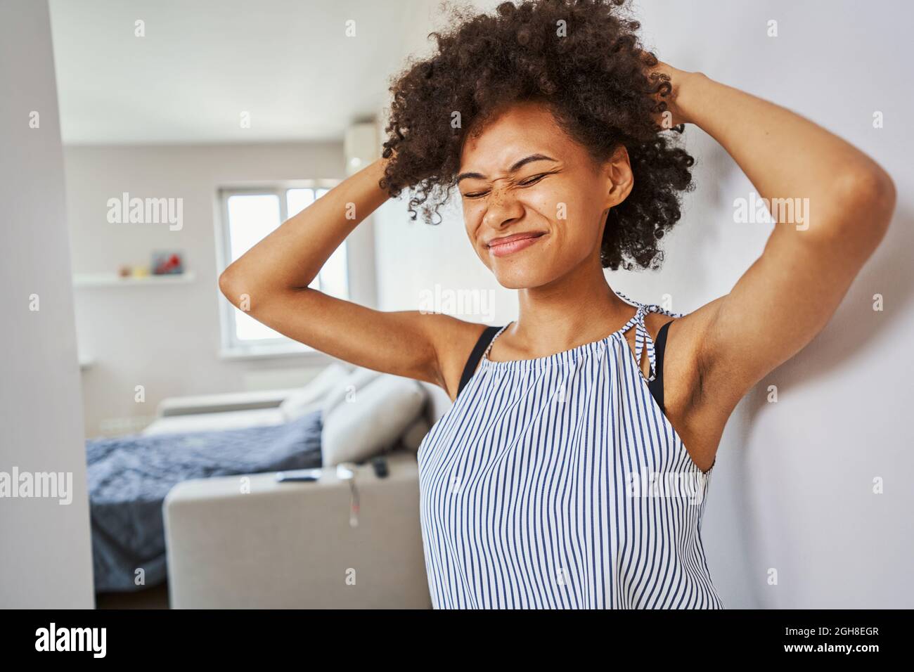 Cute dark-haired lady suffering from a splitting headache Stock Photo ...