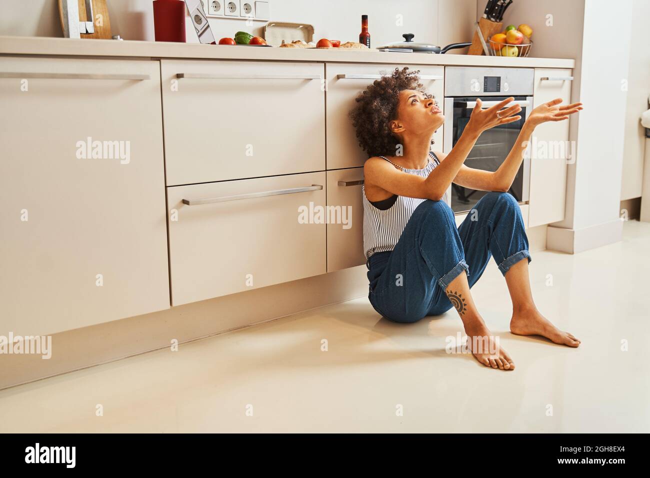 Low-spirited lady staring up at the ceiling Stock Photo - Alamy