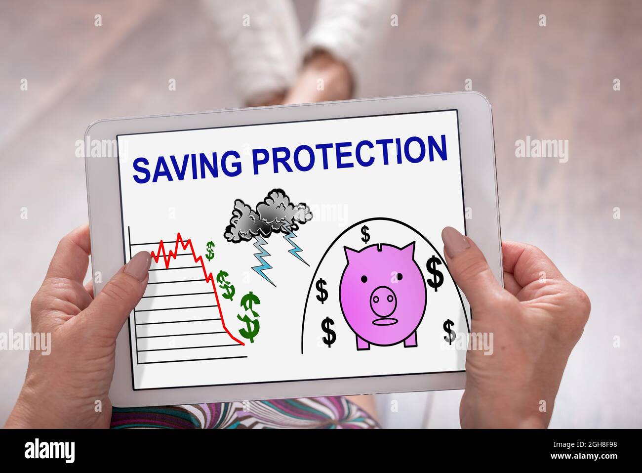 Saving protection concept shown on a tablet held by a woman Stock Photo ...