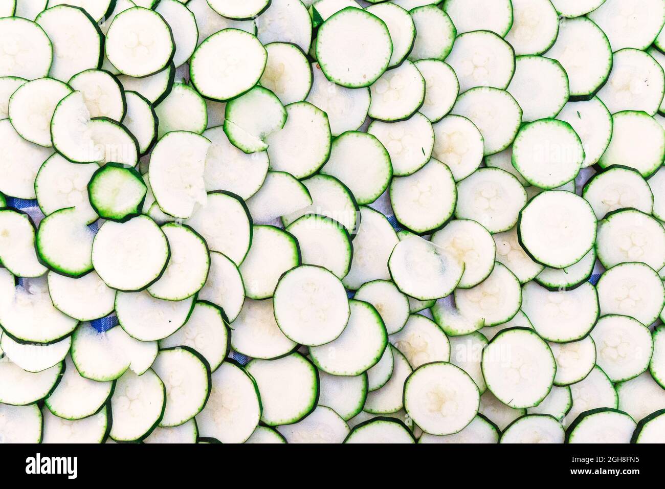 Cut zucchini pattern shot from above - courgette background Stock Photo ...