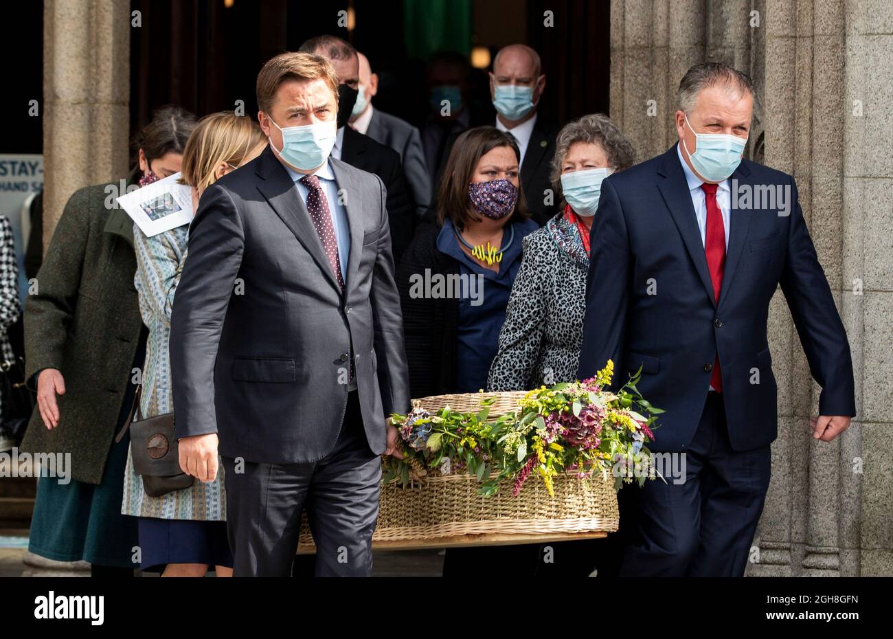 John Hume Jnr (left) and his brother Aidan (right) carry the coffin of ...