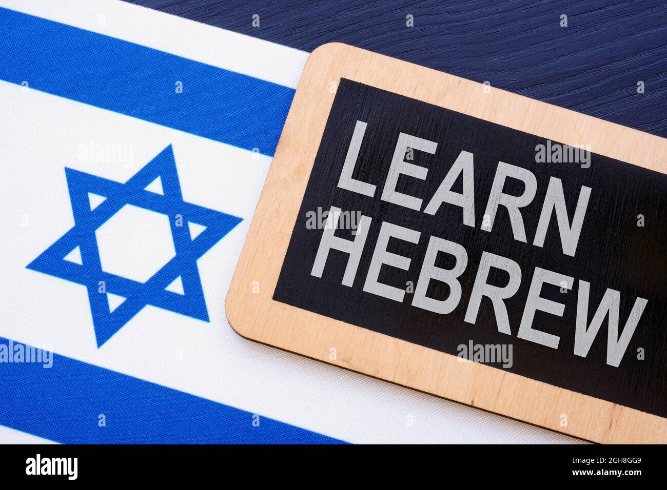 Israel flag and written words Learn Hebrew Stock Photo - Alamy