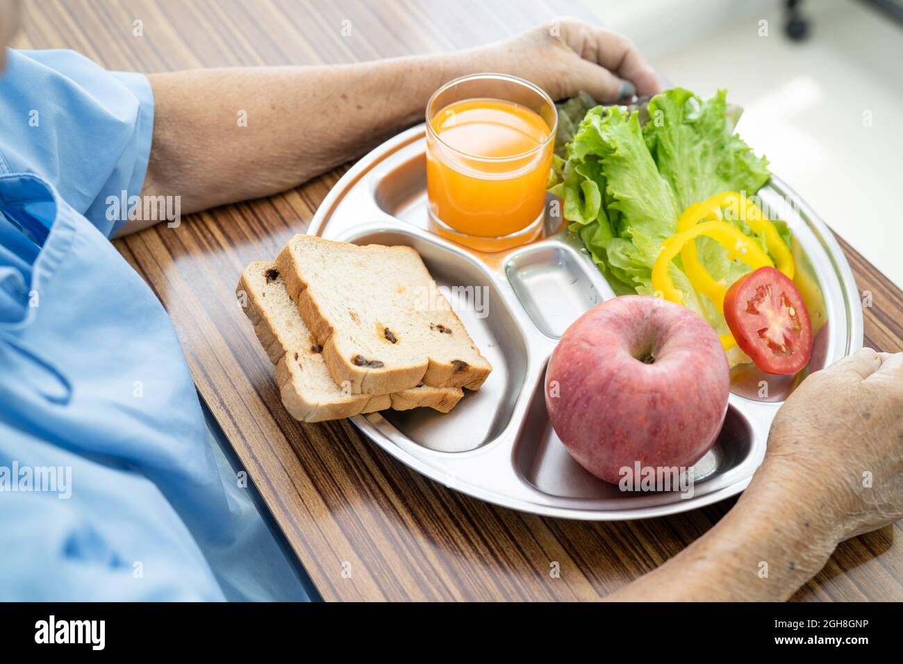 Asian senior or elderly old lady woman patient eating breakfast ...