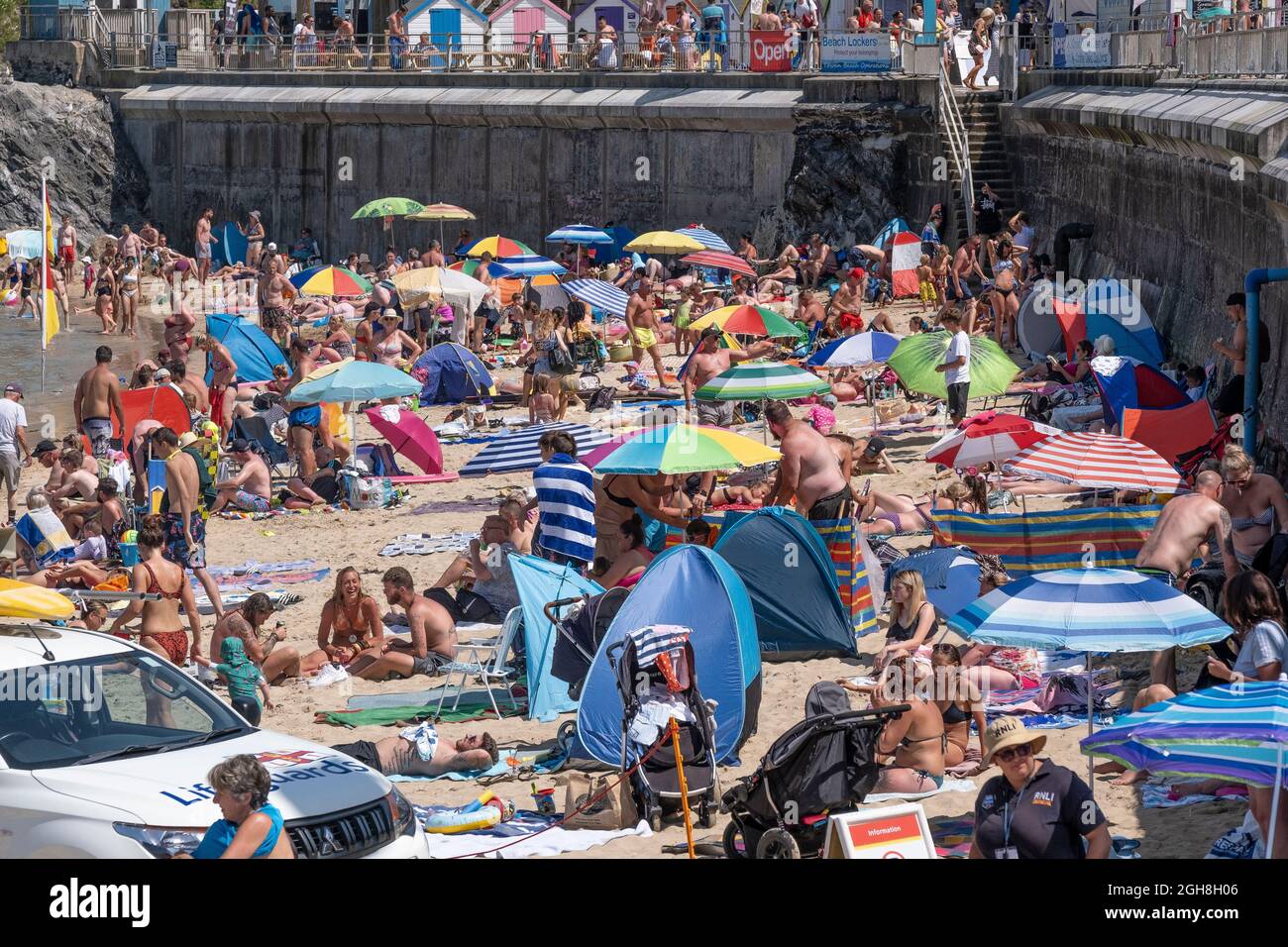 Summer holidaymakers crowd onto Towan Beach in Newquay in Cornwall ...