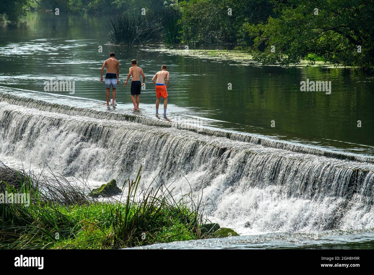 People enjoy the water at Warleigh Weir on the River Avon near Bath in ...